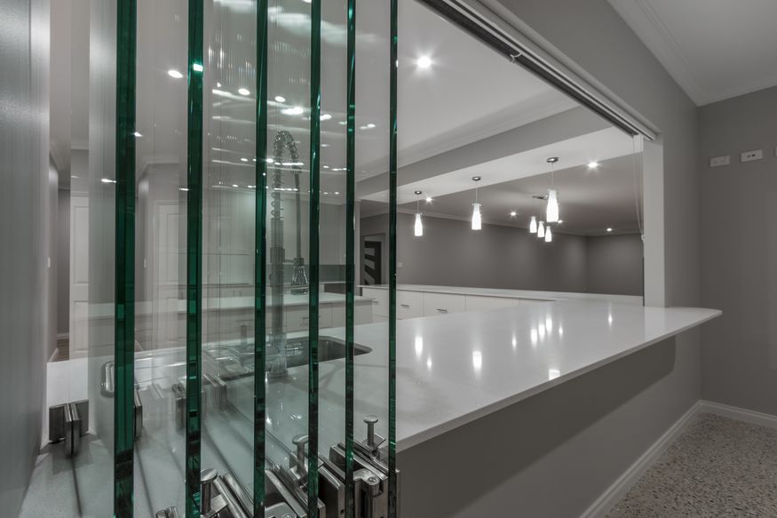 Frameless bi-folds from JH Glass Innovation | ArchitectureAu
